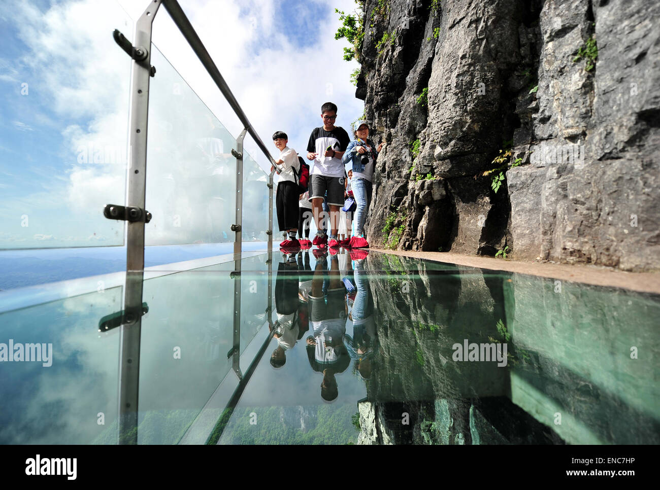Zhangjiajie, China's Hunan Province. 2nd May, 2015. Tourists walk on a ...