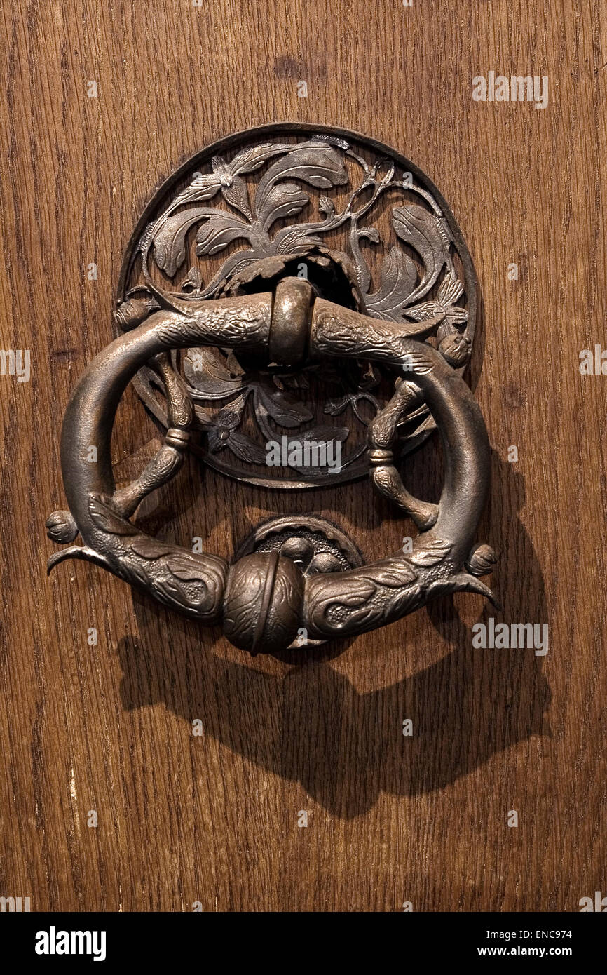 brown copper cnocker in a door in innsbruck austria Stock Photo - Alamy
