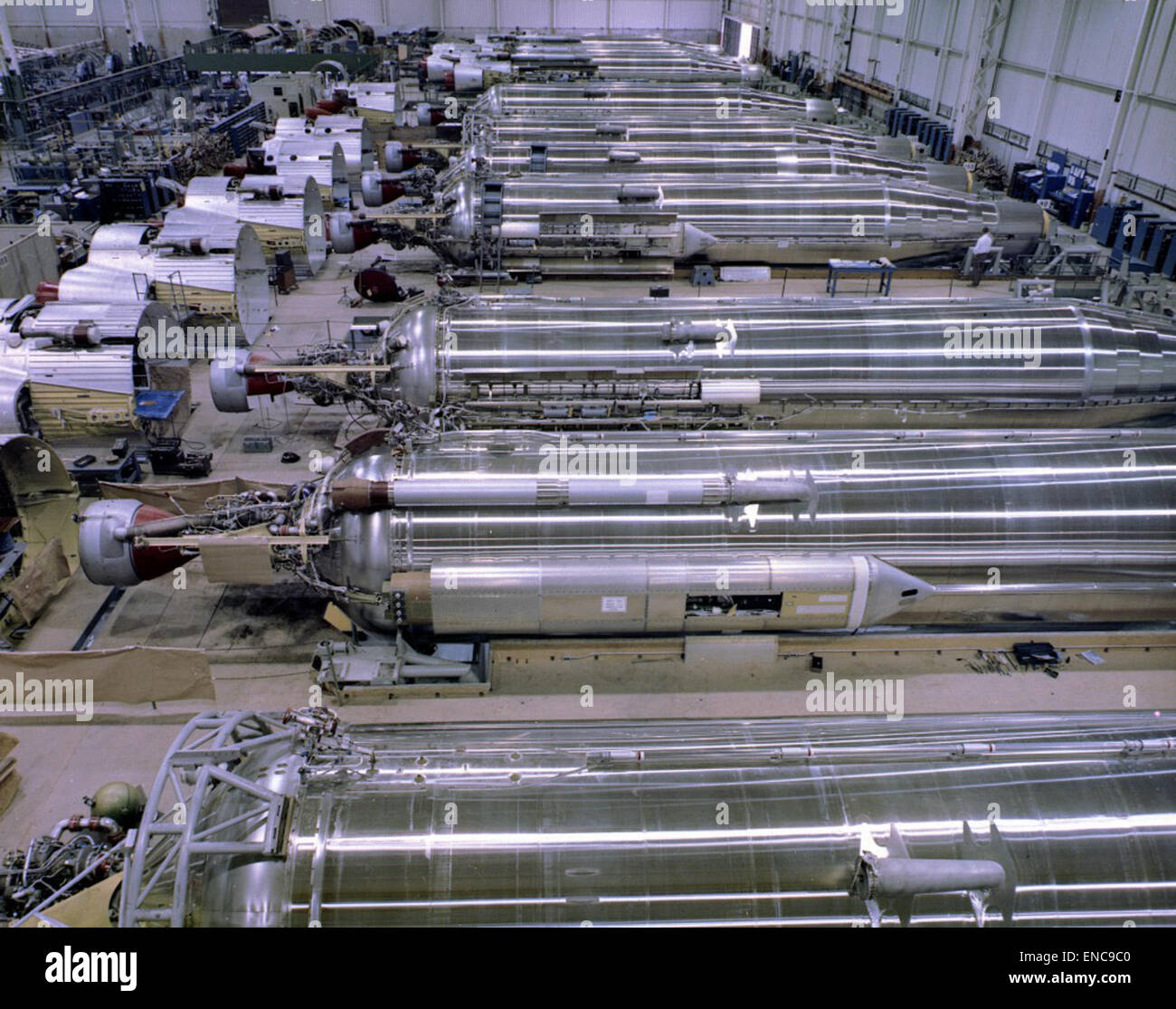 The assembly line of the Atlas rocket is shown, depicting the ...