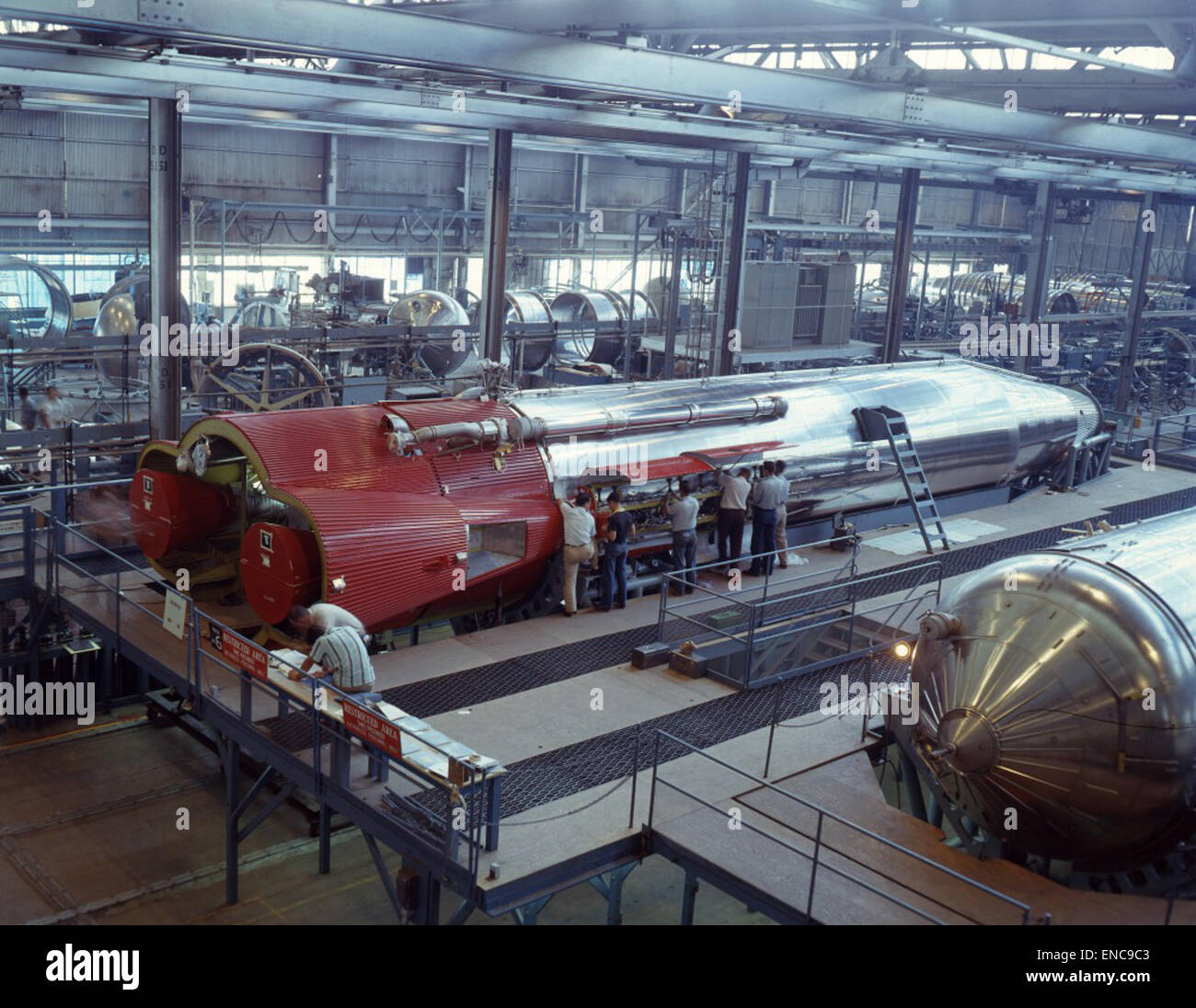 The Atlas missile assembly line is captured in this photograph, showing ...