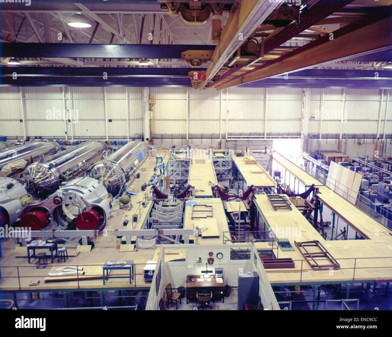 A 1959 progress report photograph showing the assembly line of Atlas ...