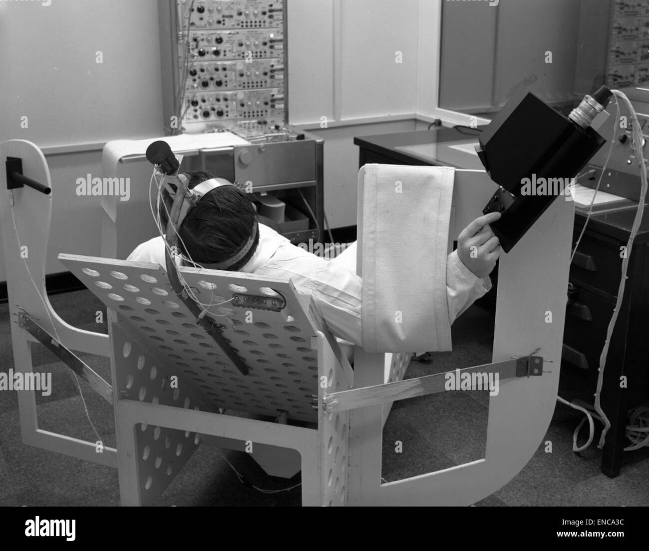 A photograph featuring a human test subject used in early aviation or ...