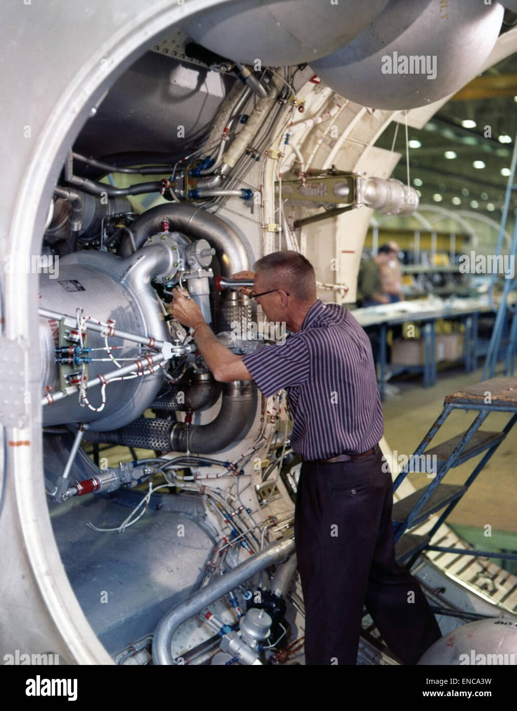 A photograph showing the installation of booster engines for Series E ...
