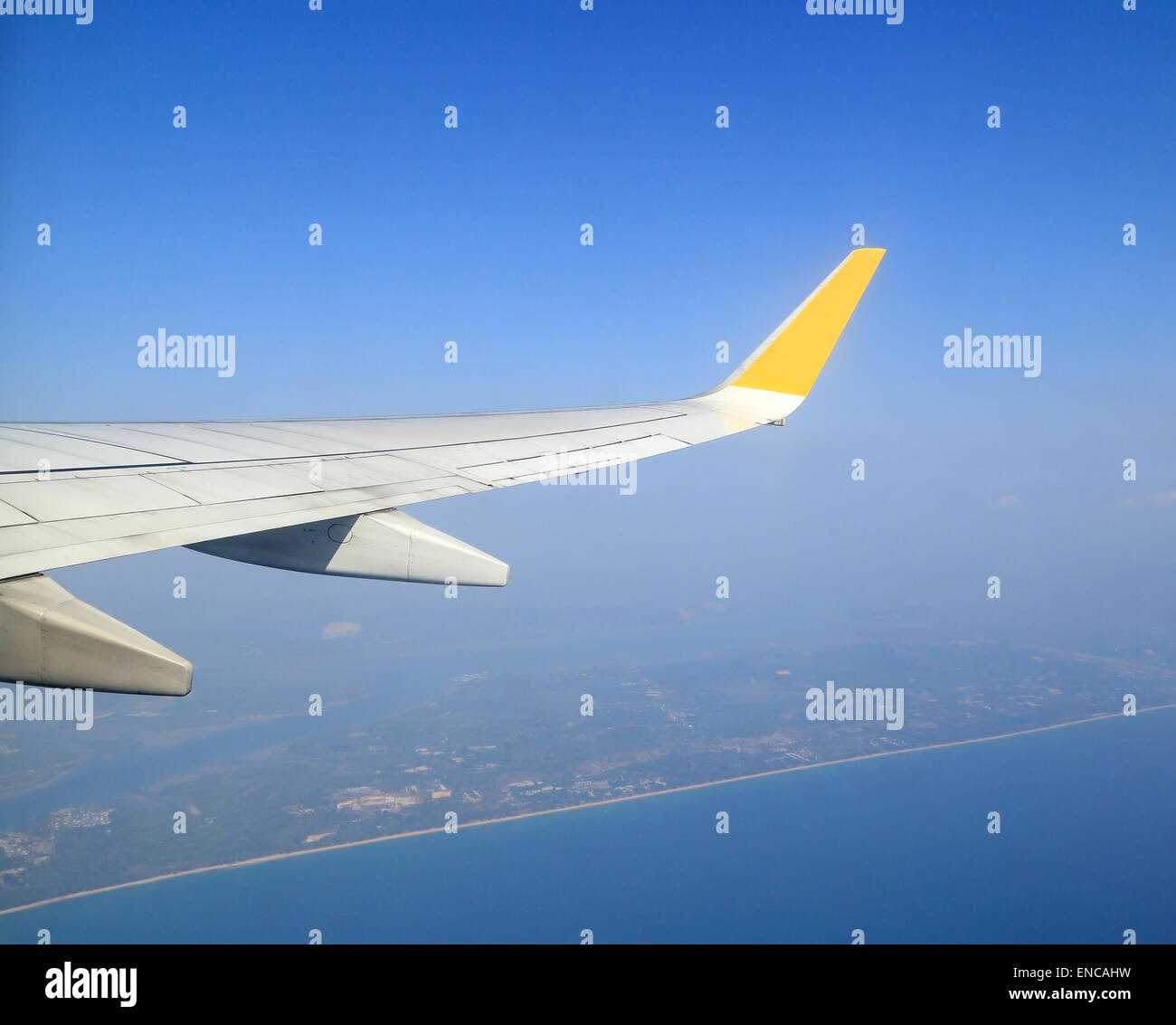 Wing of an airplane flying above the sky Stock Photo - Alamy