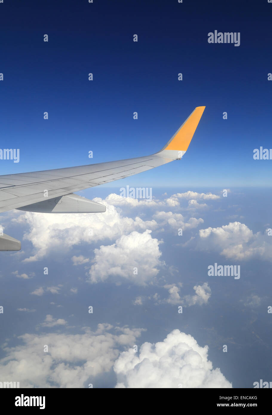 Wing of an airplane flying above the sky Stock Photo - Alamy