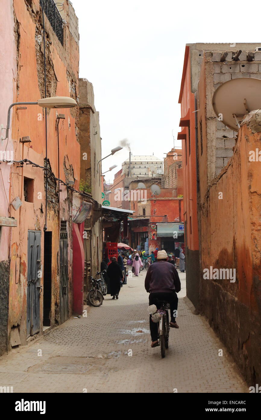 A typical street scene in Marrakech, Morocco with pedestrians and a ...