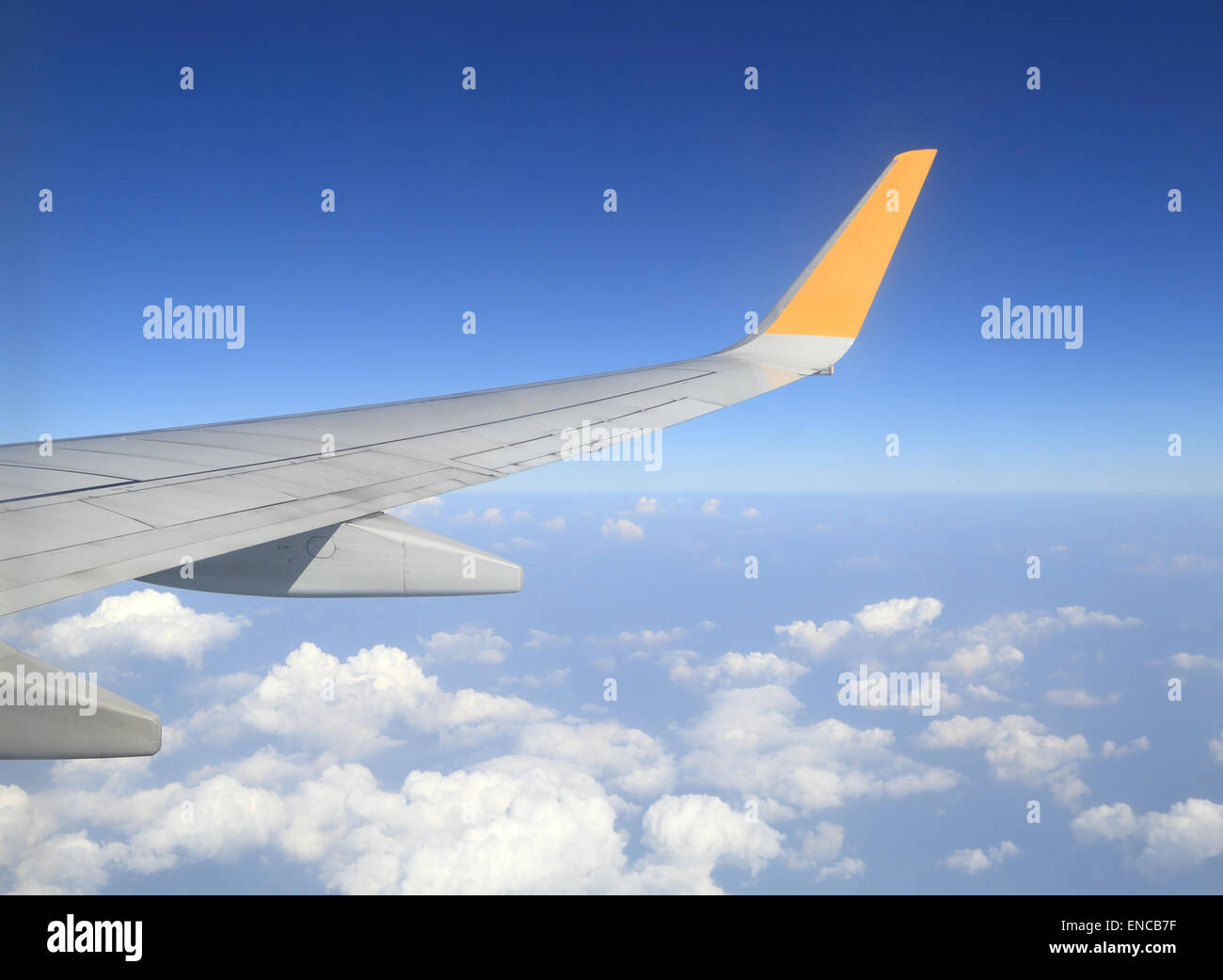Wing of an airplane flying above the sky Stock Photo - Alamy