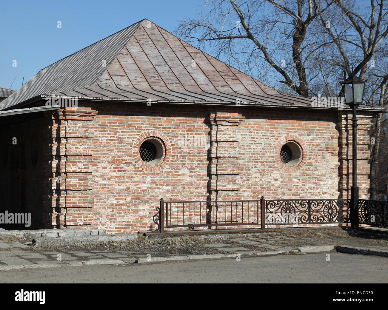 An example of an old brick house with small round windows Stock Photo ...