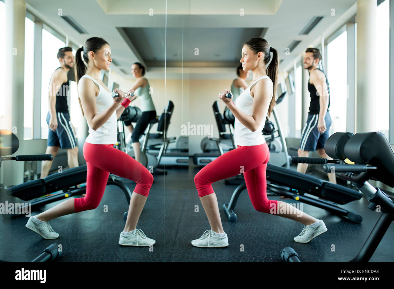 Young woman training in the gym Stock Photo - Alamy