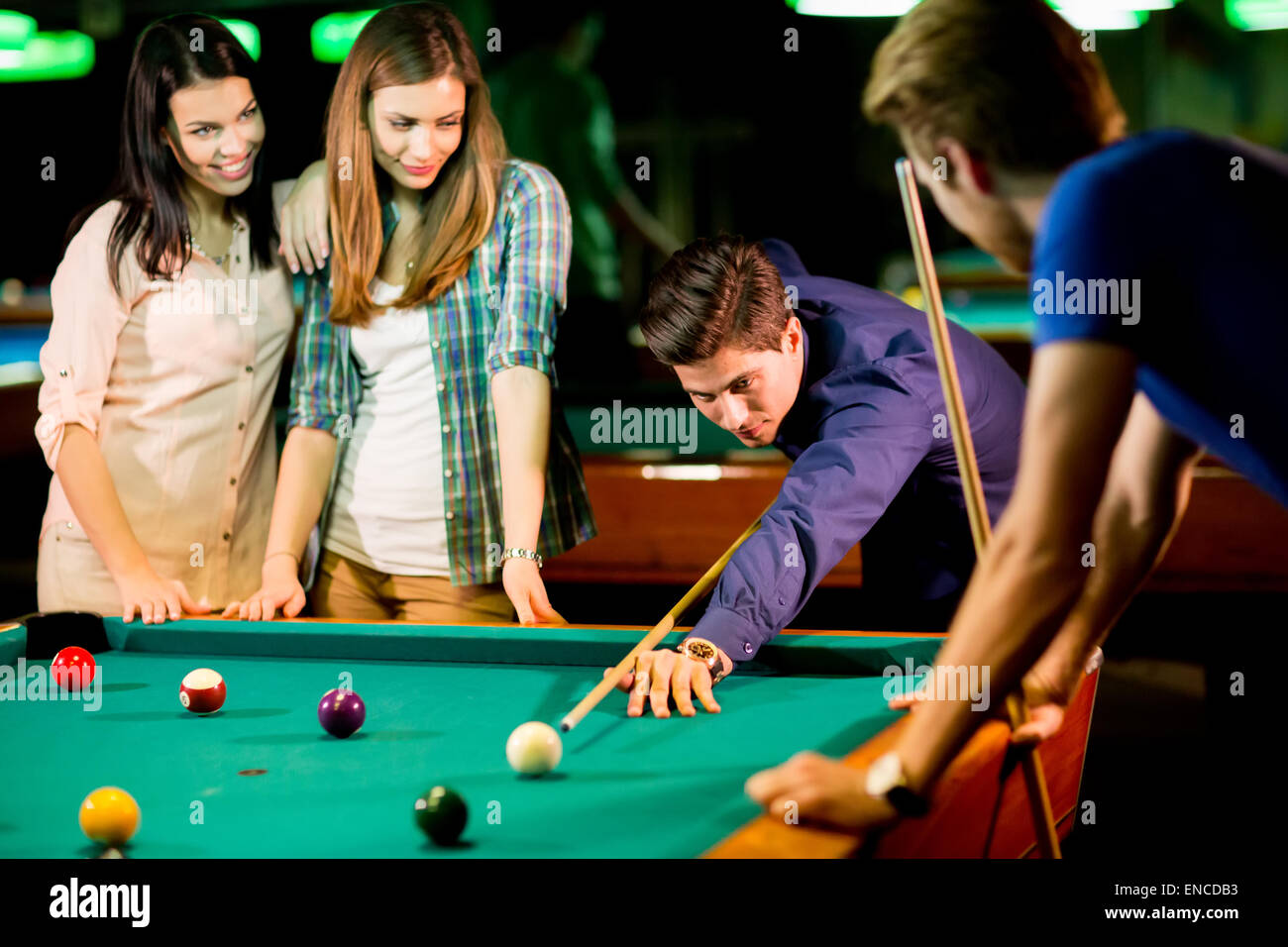 Young people playing pool Stock Photo - Alamy