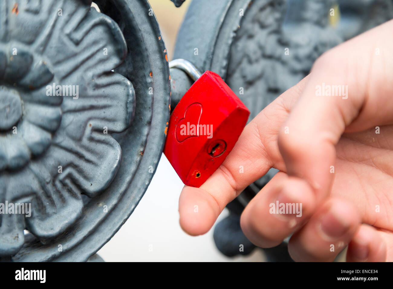 Hand showing red padlock hi-res stock photography and images - Alamy