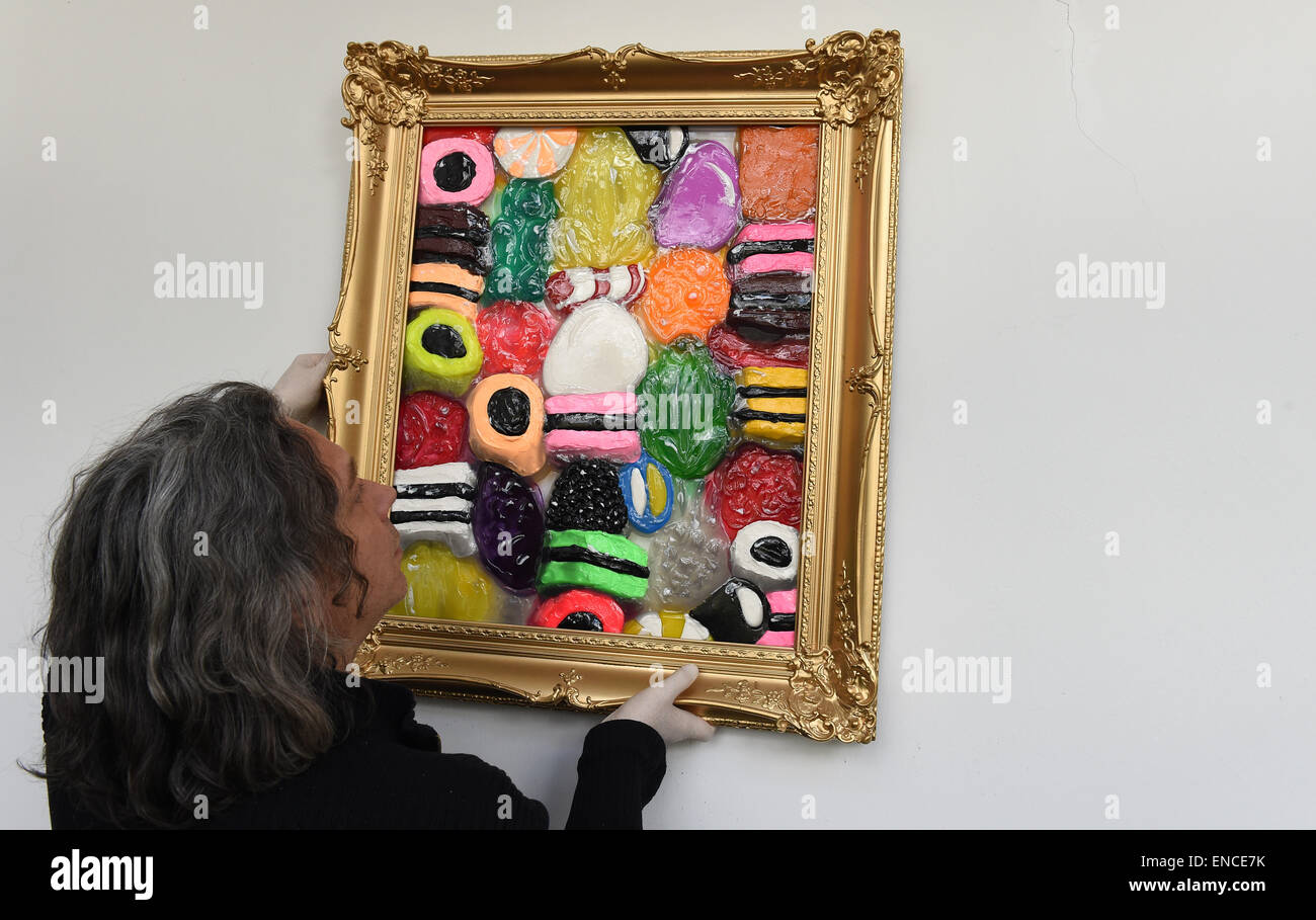 Bremen, Germany. 22nd Apr, 2015. Artist Ulrik Dannenberg mounts one of ...