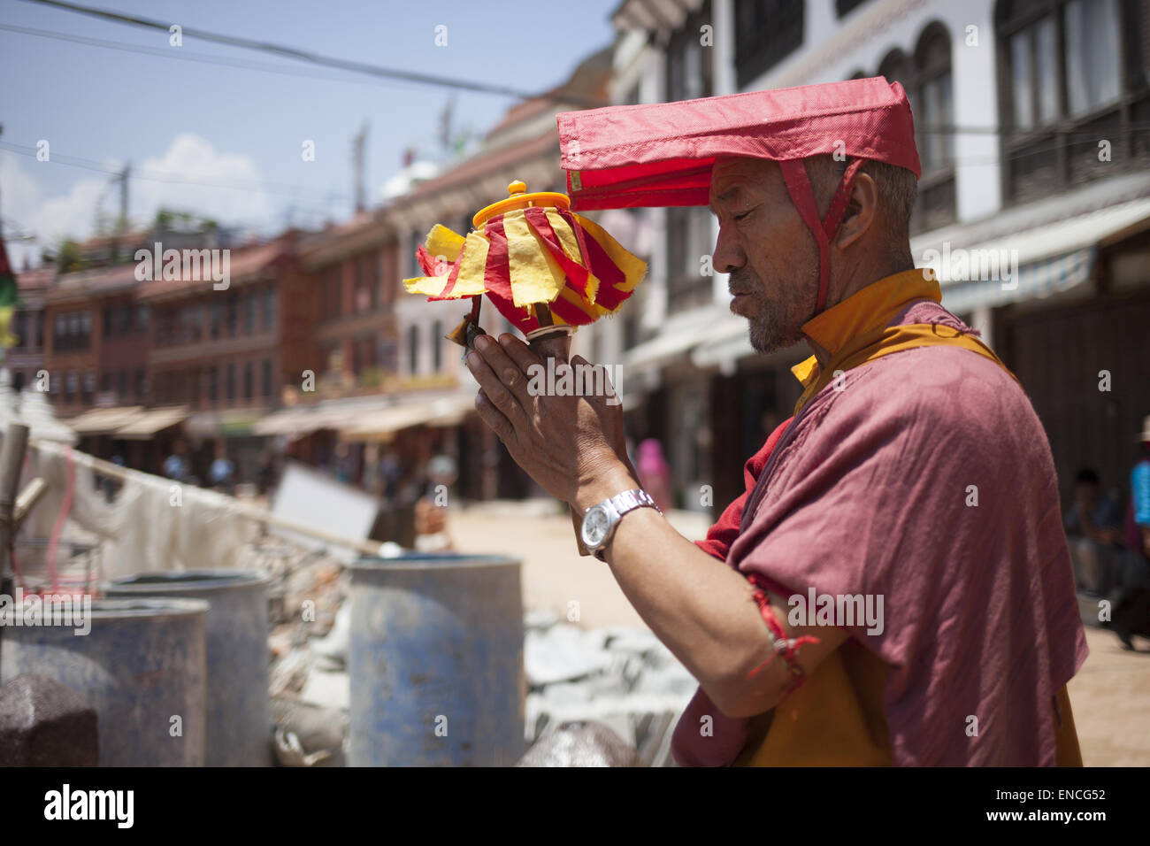 Nepal. 2nd May, 2015. A Holy man sets prays in front of at Buddha Nath ...