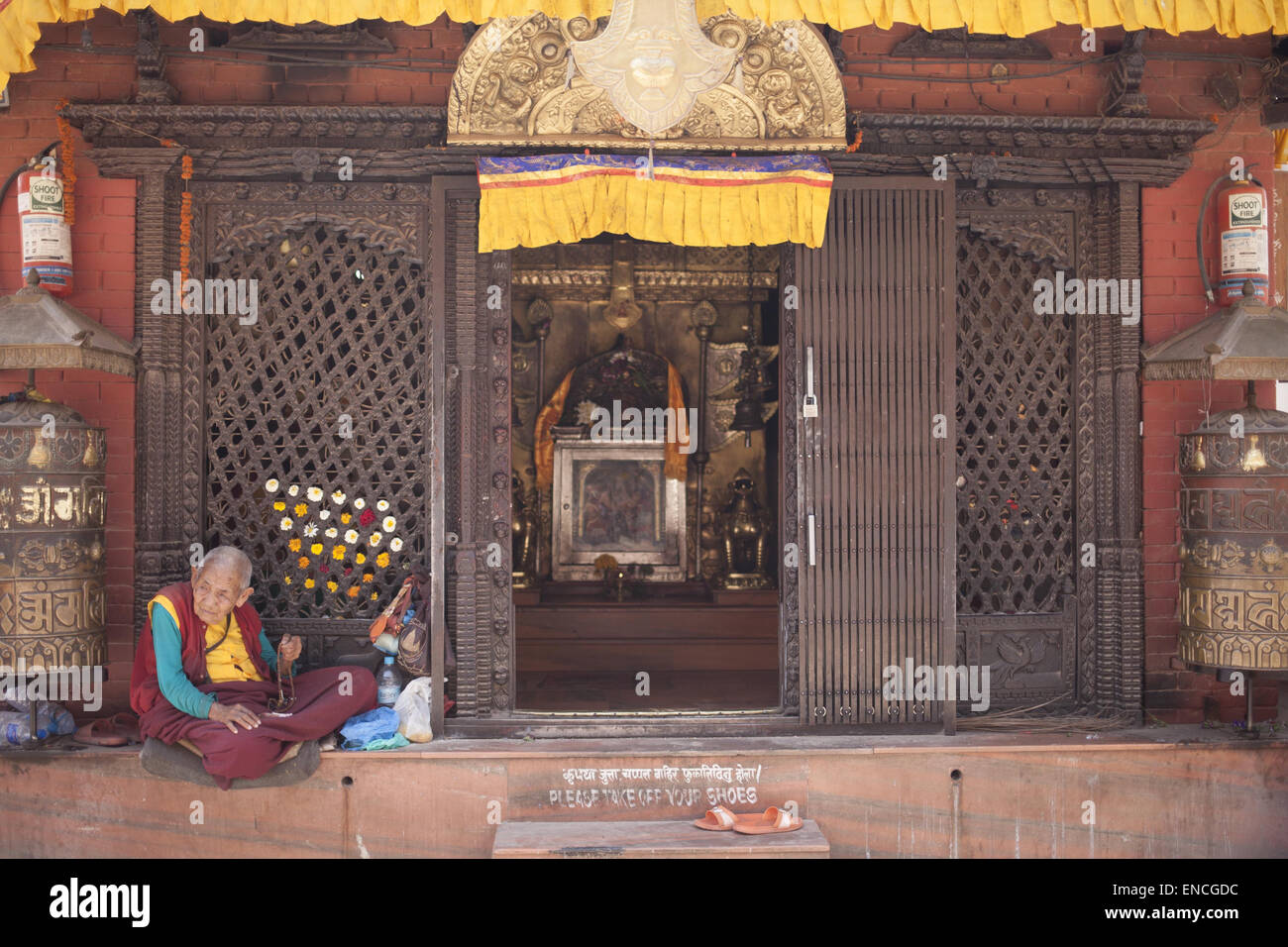 Nepal. 2nd May, 2015. A Holy man sets and prays in a temple at Buddha ...
