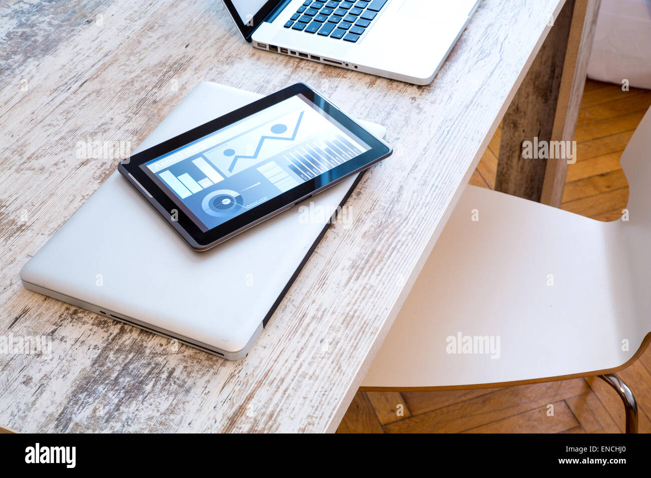 A office setup with a Laptop computer and a Tablet PC Stock Photo - Alamy
