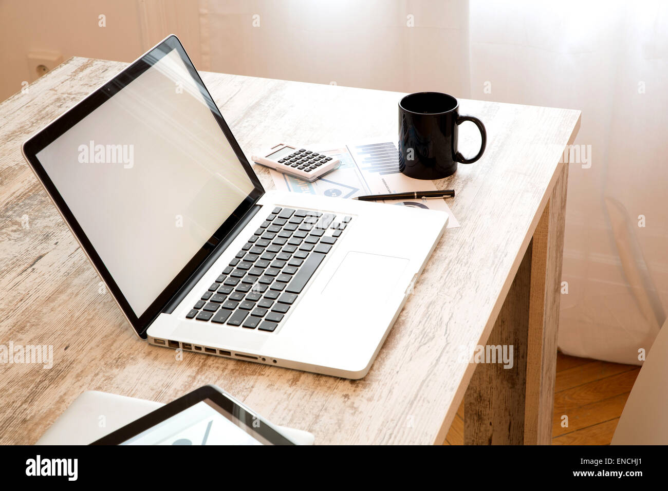 A office setup with a Laptop computer and a Tablet PC Stock Photo - Alamy