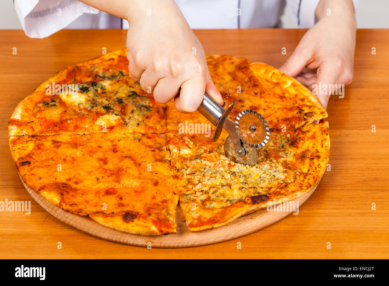 Chef cuts pizza knife hi-res stock photography and images - Alamy