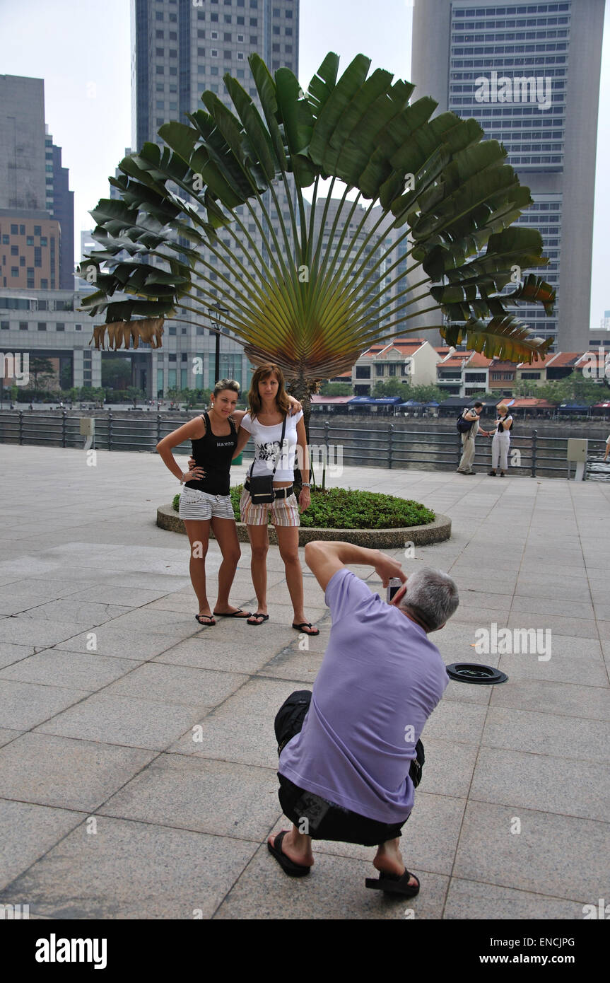 SINGAPORE, FEBRUARY 13: Man photographs unidentified women on February ...