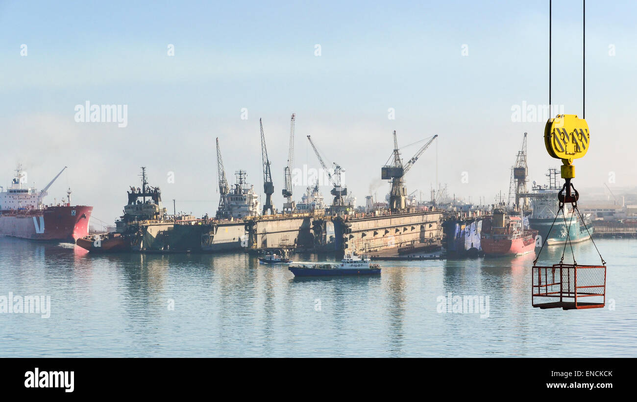 Crane, crate and dry docks of the port of Walvis Bay, Namibia Stock ...