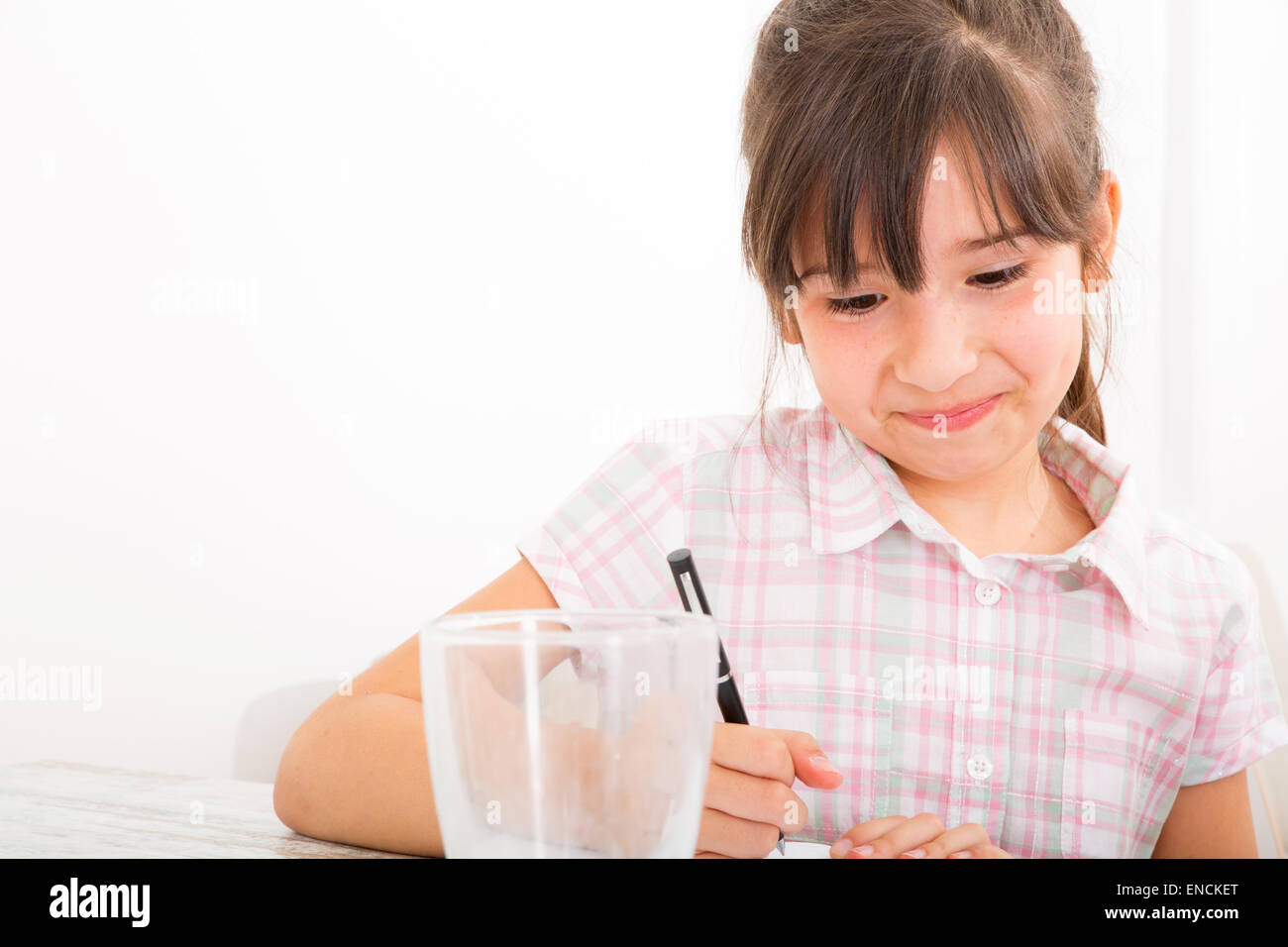 Portrait of daughter doing her homework Stock Photo - Alamy