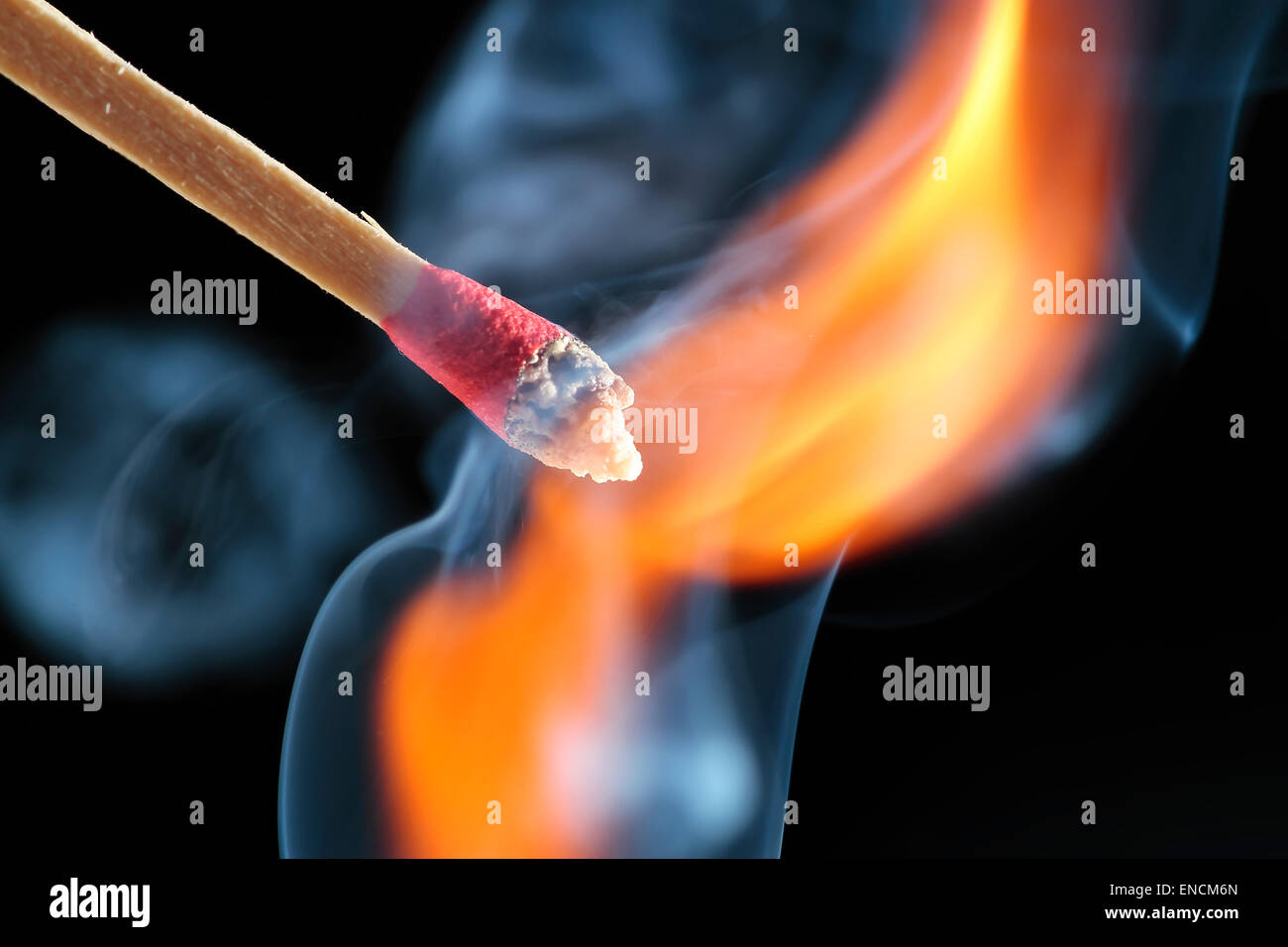 closeup of a burning matchstick on black background Stock Photo - Alamy