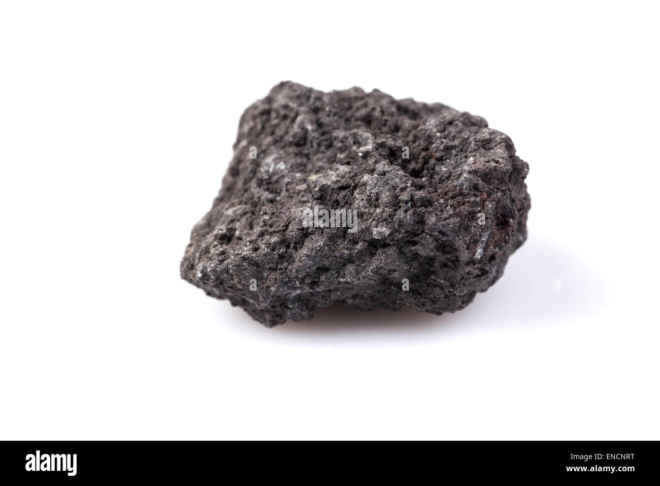 Black lava rock from volcano on a white background Stock Photo - Alamy