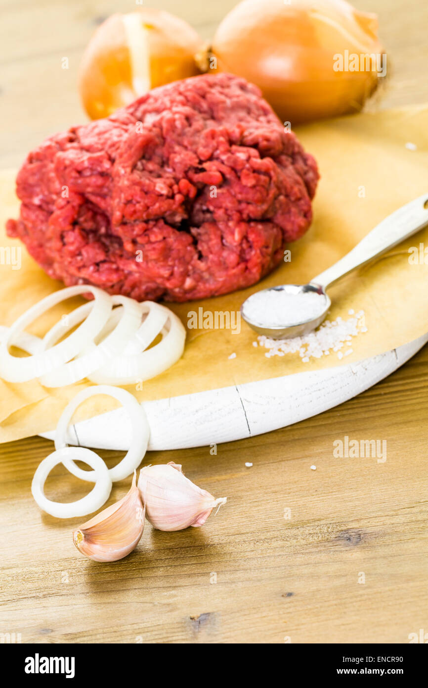 Ground beef on the table with other ingredients for recipe Stock Photo ...