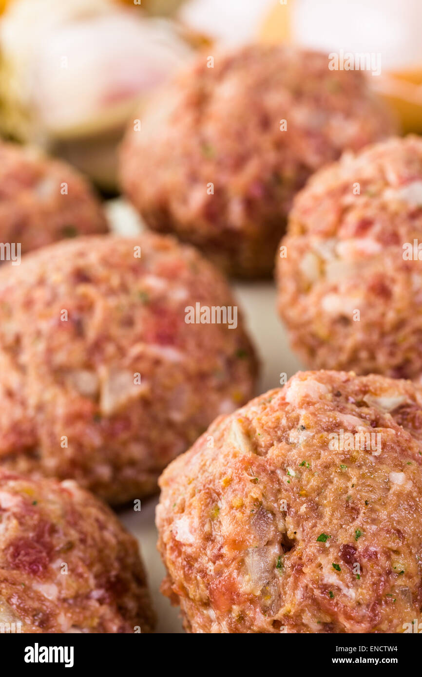 Cooking large homemade Italian meatballs for dinner Stock Photo - Alamy