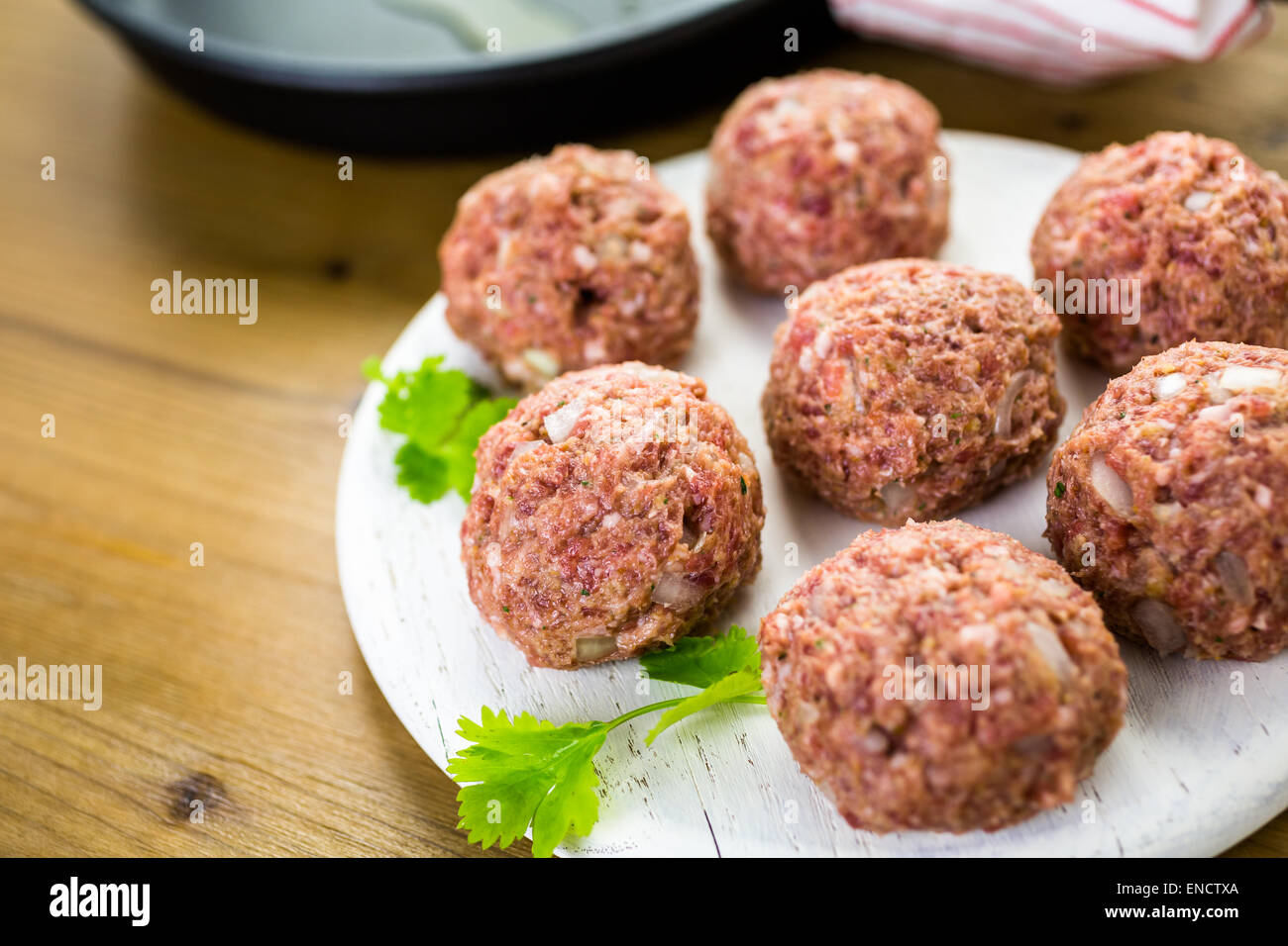 Cooking large homemade Italian meatballs for dinner Stock Photo - Alamy