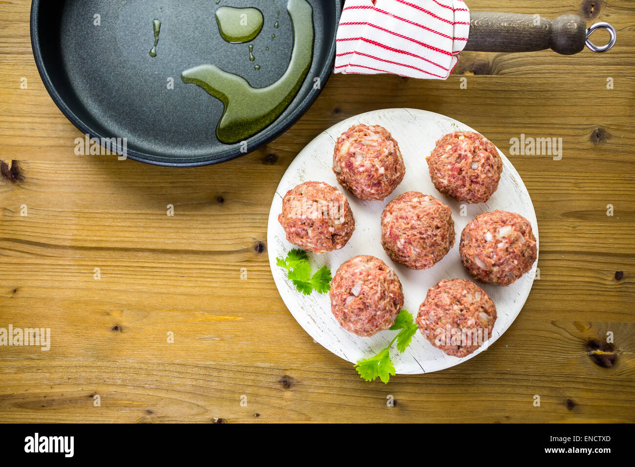 Cooking large homemade Italian meatballs for dinner Stock Photo - Alamy