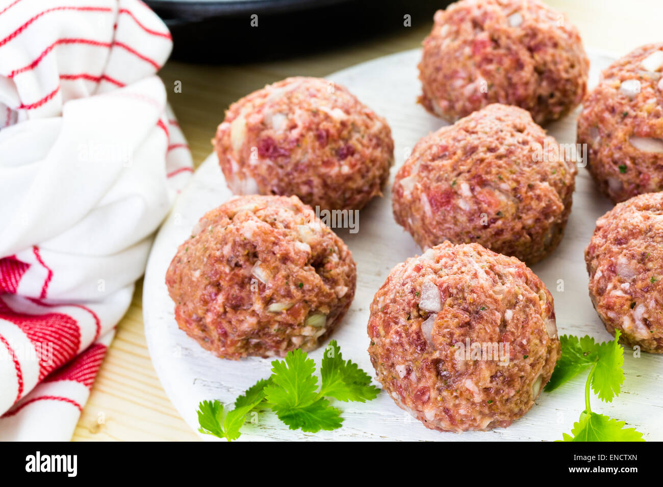 Cooking large homemade Italian meatballs for dinner Stock Photo - Alamy