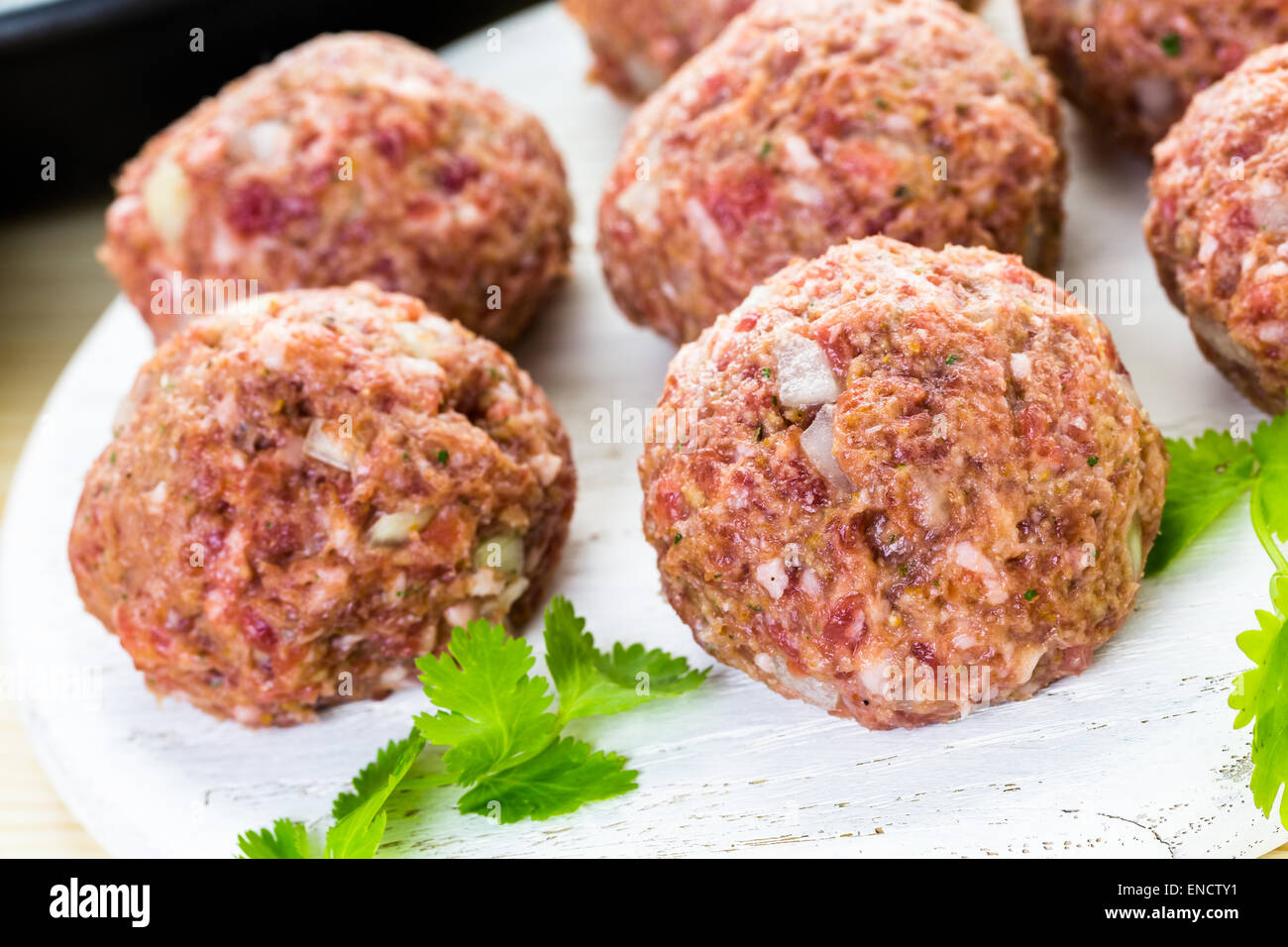 Cooking large homemade Italian meatballs for dinner Stock Photo - Alamy