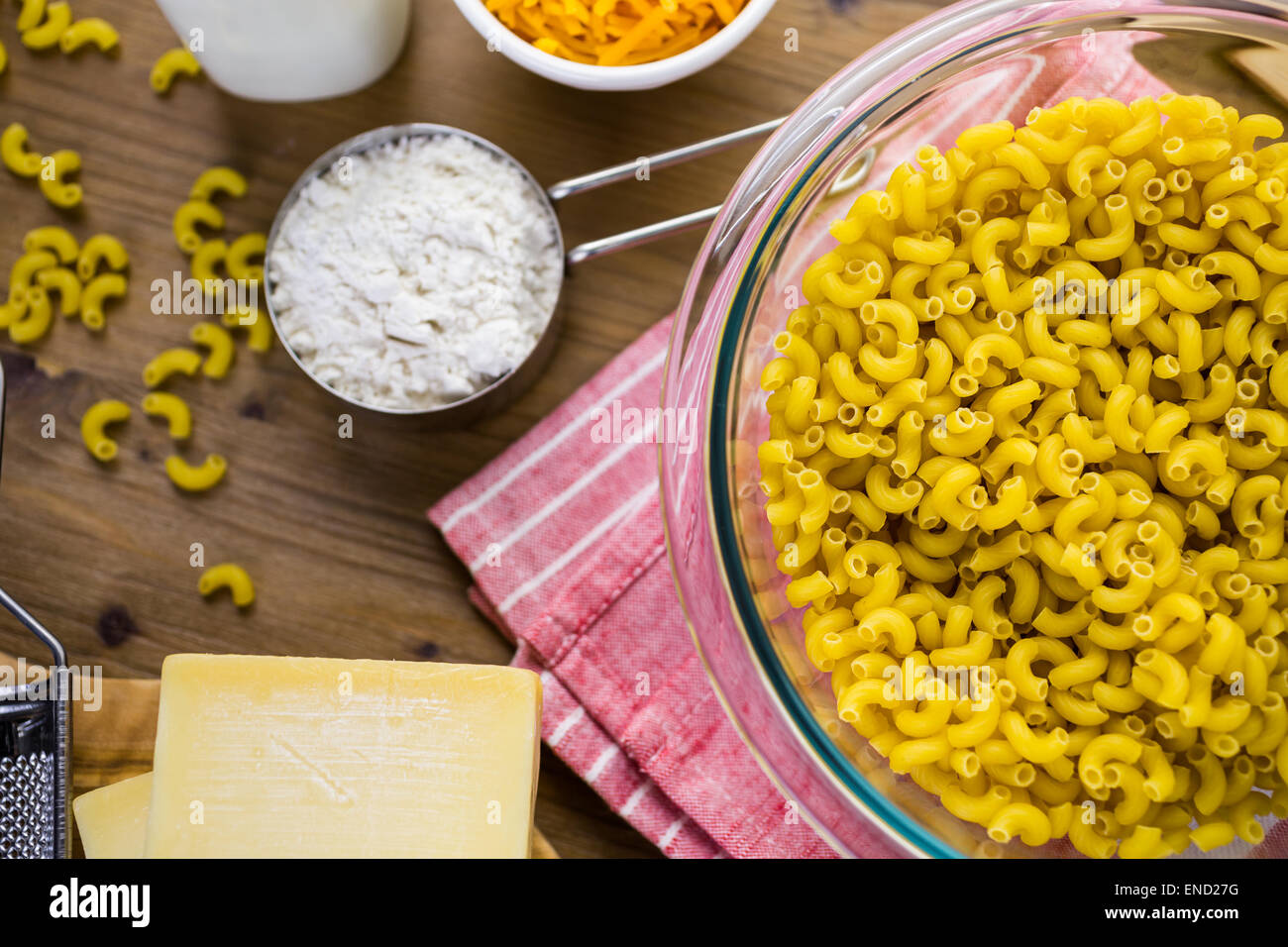 Ingredients for preparing macaroni and cheese on a wood table Stock ...