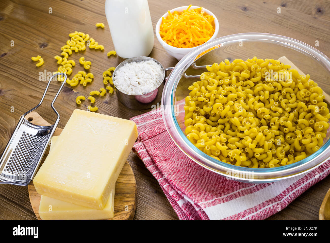 Ingredients for preparing macaroni and cheese on a wood table Stock ...