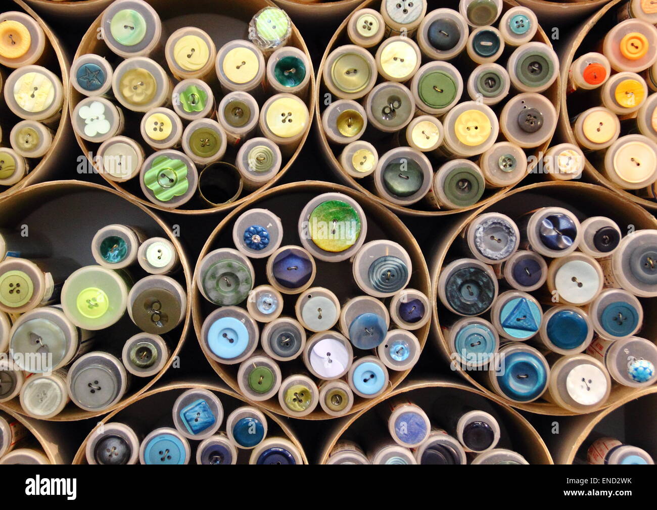 Isolated button collection in separately tubes Stock Photo - Alamy