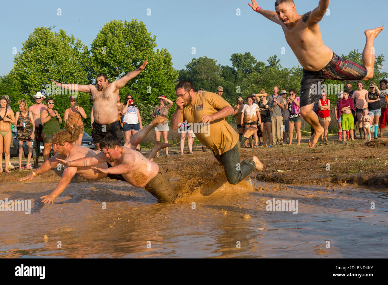 Competitor belly flop into a muddy watering hole during the dive ...