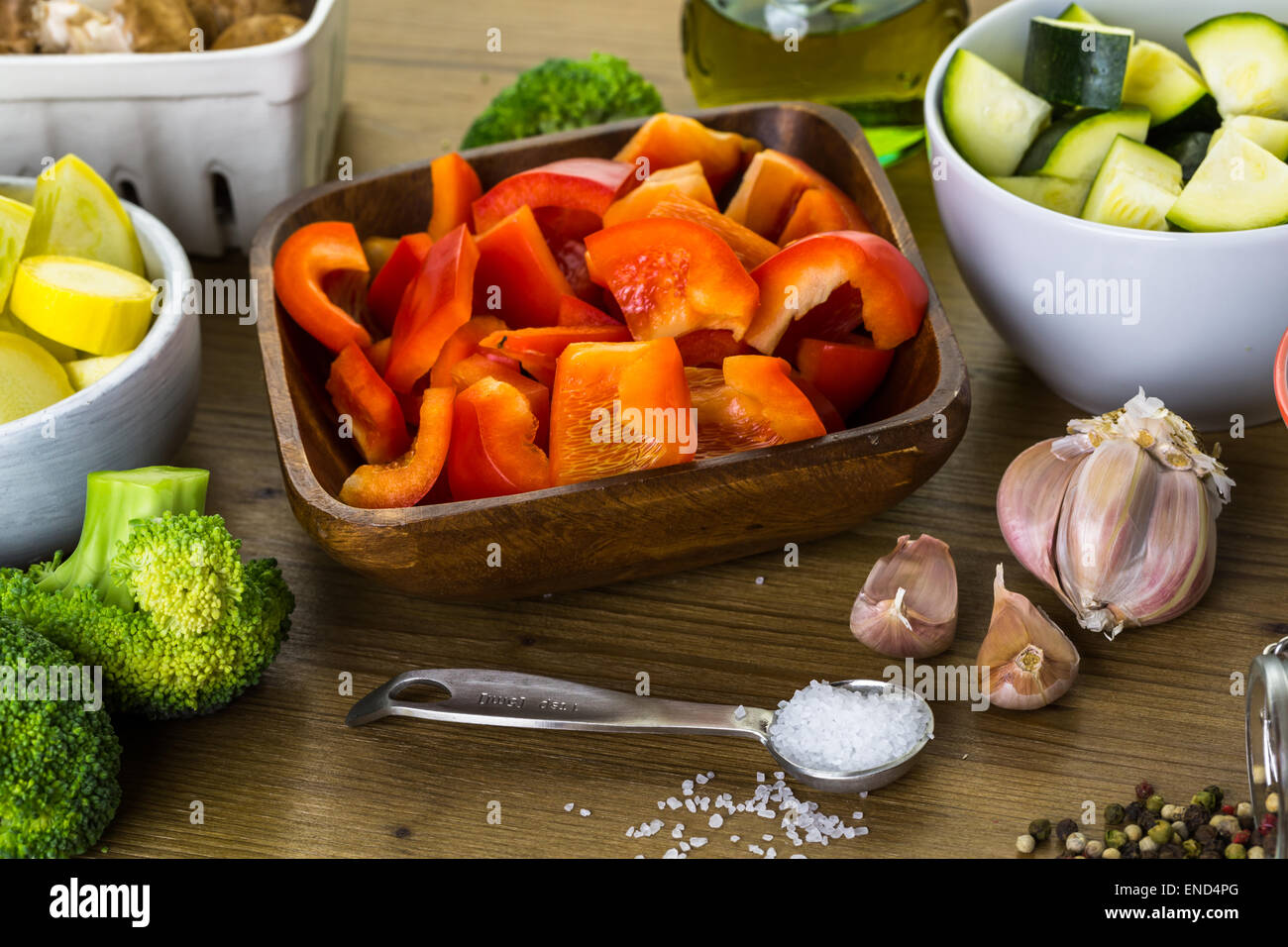 Fresh ingredients for preparing roasted mixed vegetables on the table ...