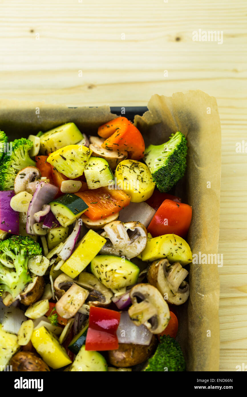 Preparing fresh roasted mixed vegetables for dinner Stock Photo - Alamy
