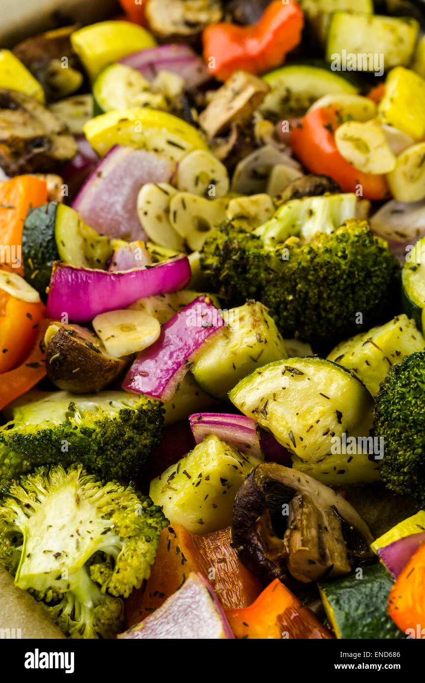 Preparing fresh roasted mixed vegetables for dinner Stock Photo - Alamy
