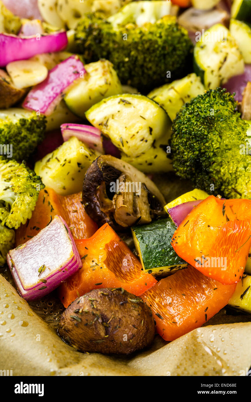 Preparing fresh roasted mixed vegetables for dinner Stock Photo - Alamy