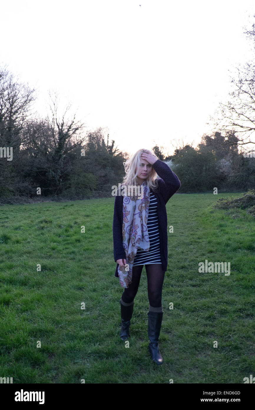 Young woman taking a stroll through the woods Stock Photo - Alamy