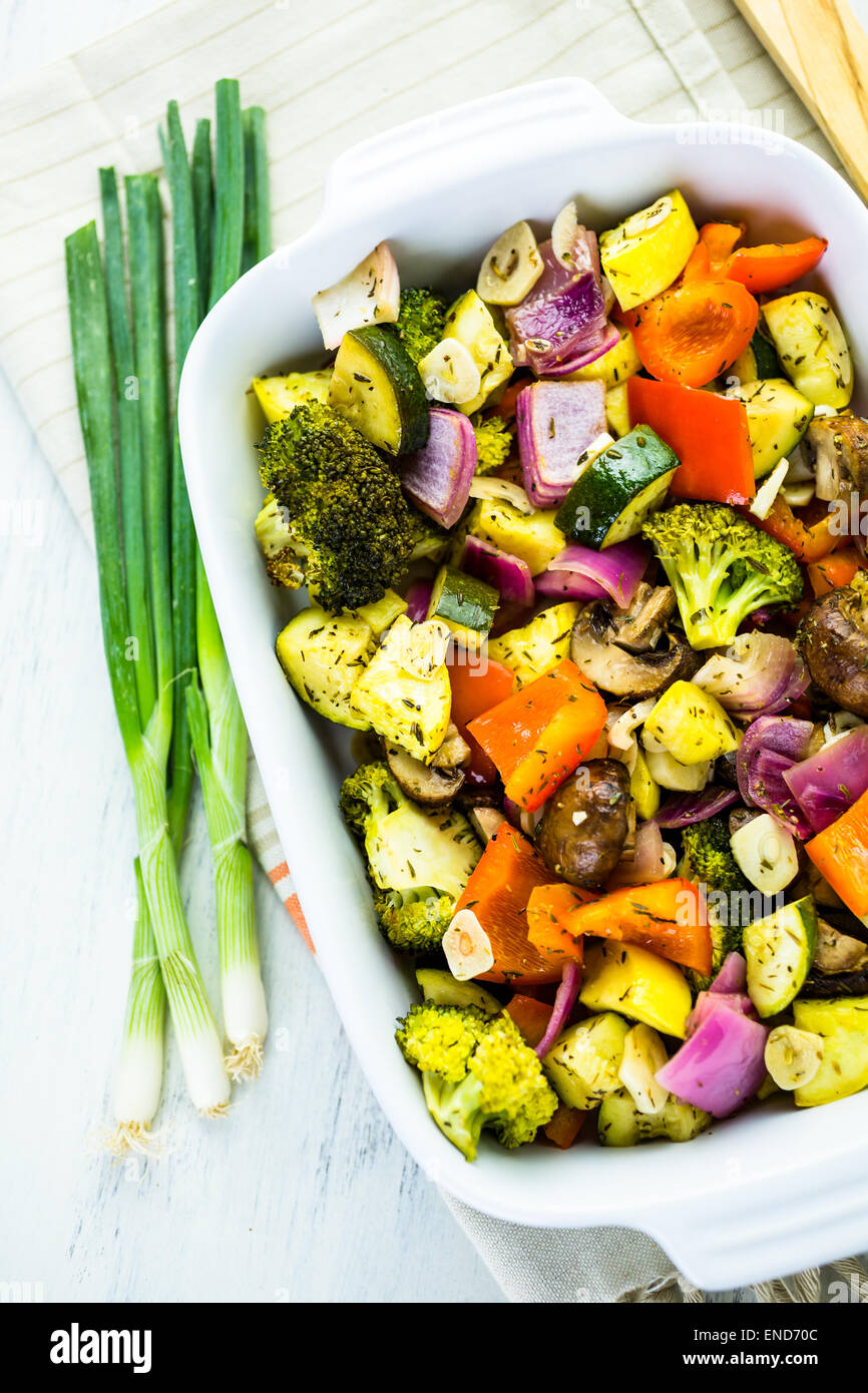 Preparing fresh roasted mixed vegetables for dinner Stock Photo - Alamy