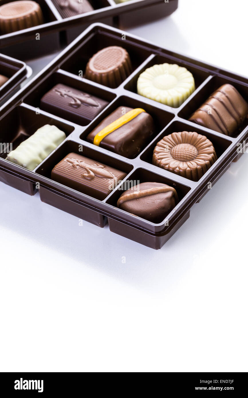 Assorted chocolates in box on a white background Stock Photo - Alamy