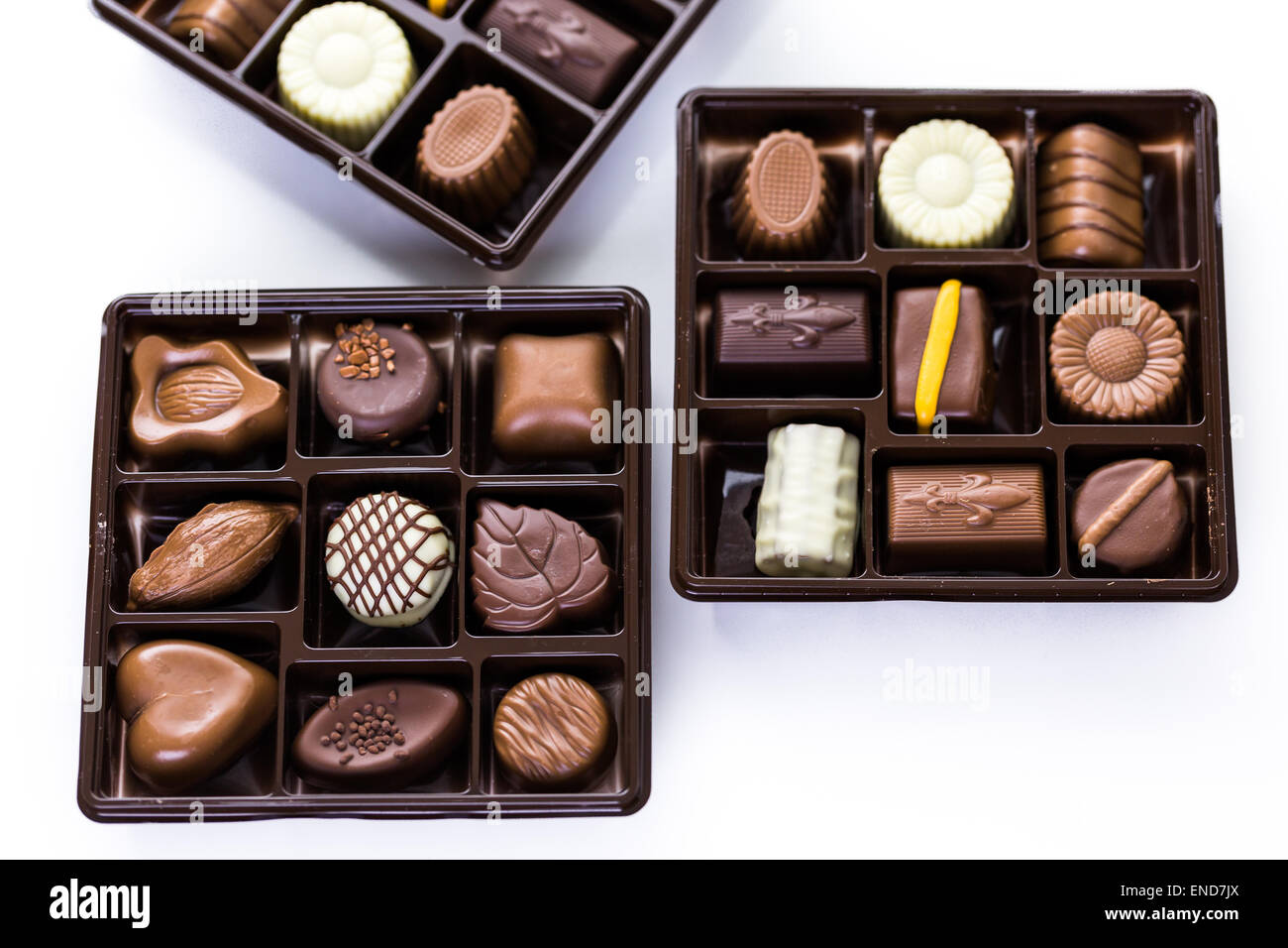 Assorted chocolates in box on a white background Stock Photo - Alamy