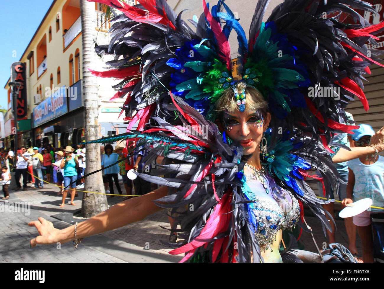 Troupes of masqueraders display colorful and traditional costumes ...