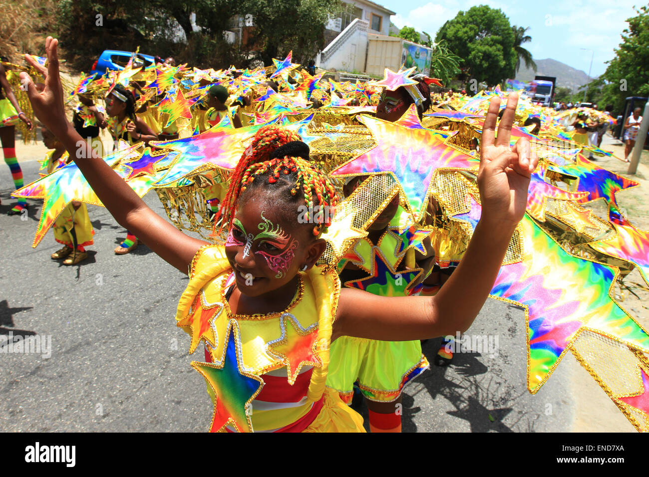 Troupes of masqueraders display colorful and traditional costumes ...