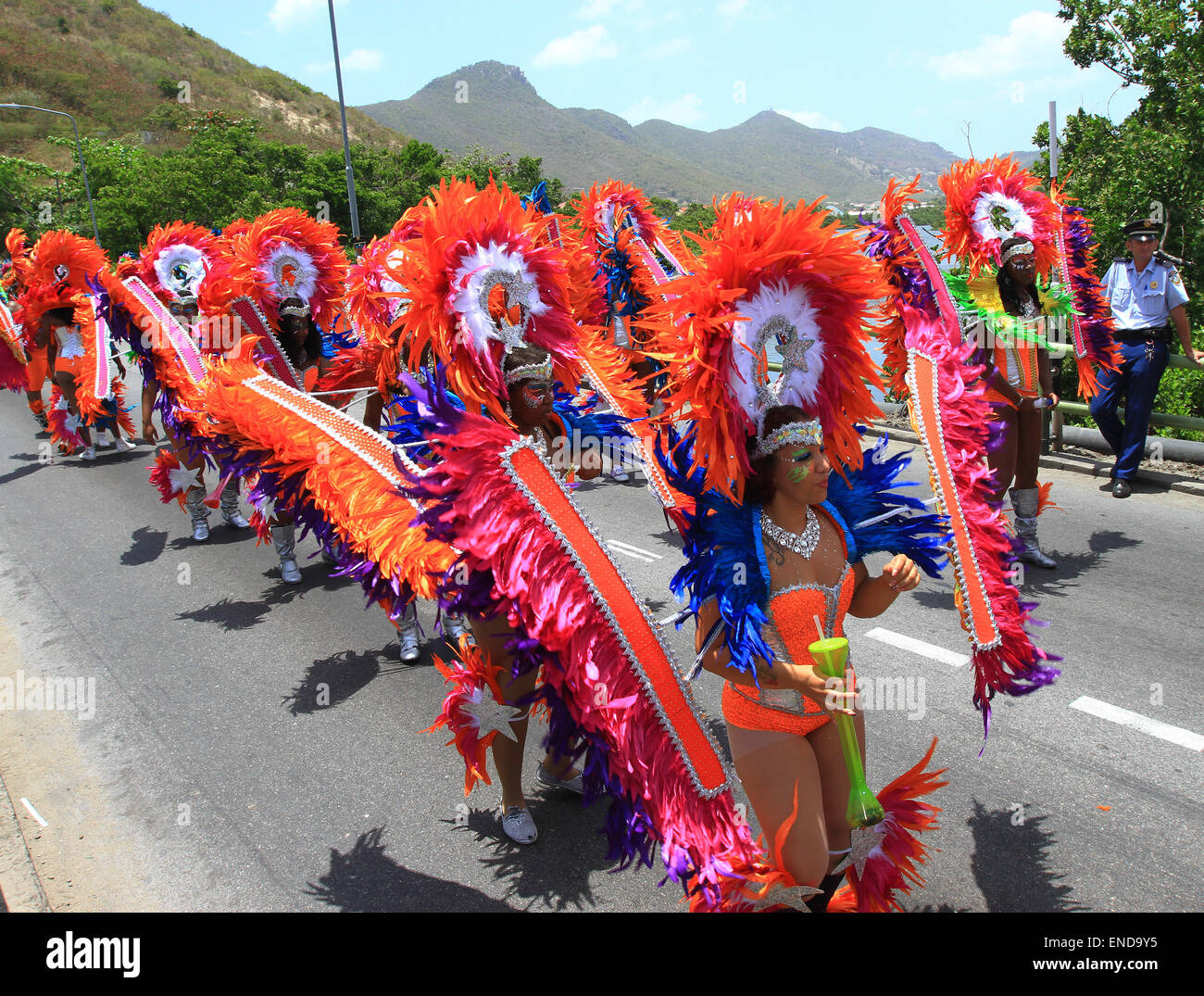 Troupes of masqueraders display colorful and traditional costumes ...