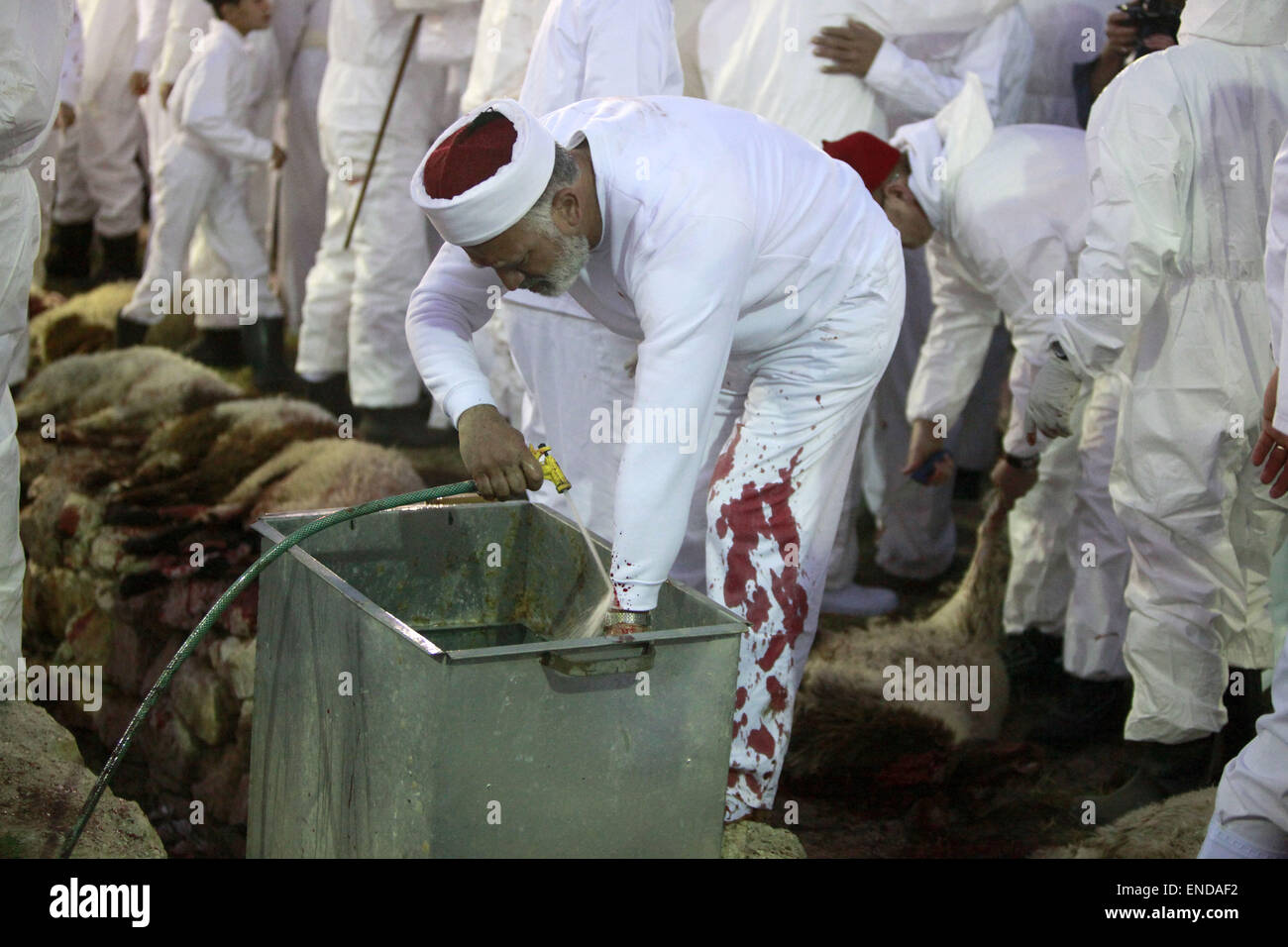 Mount Gerizim, West Bank. 3rd May, 2015. Samaritan man washes his hands ...