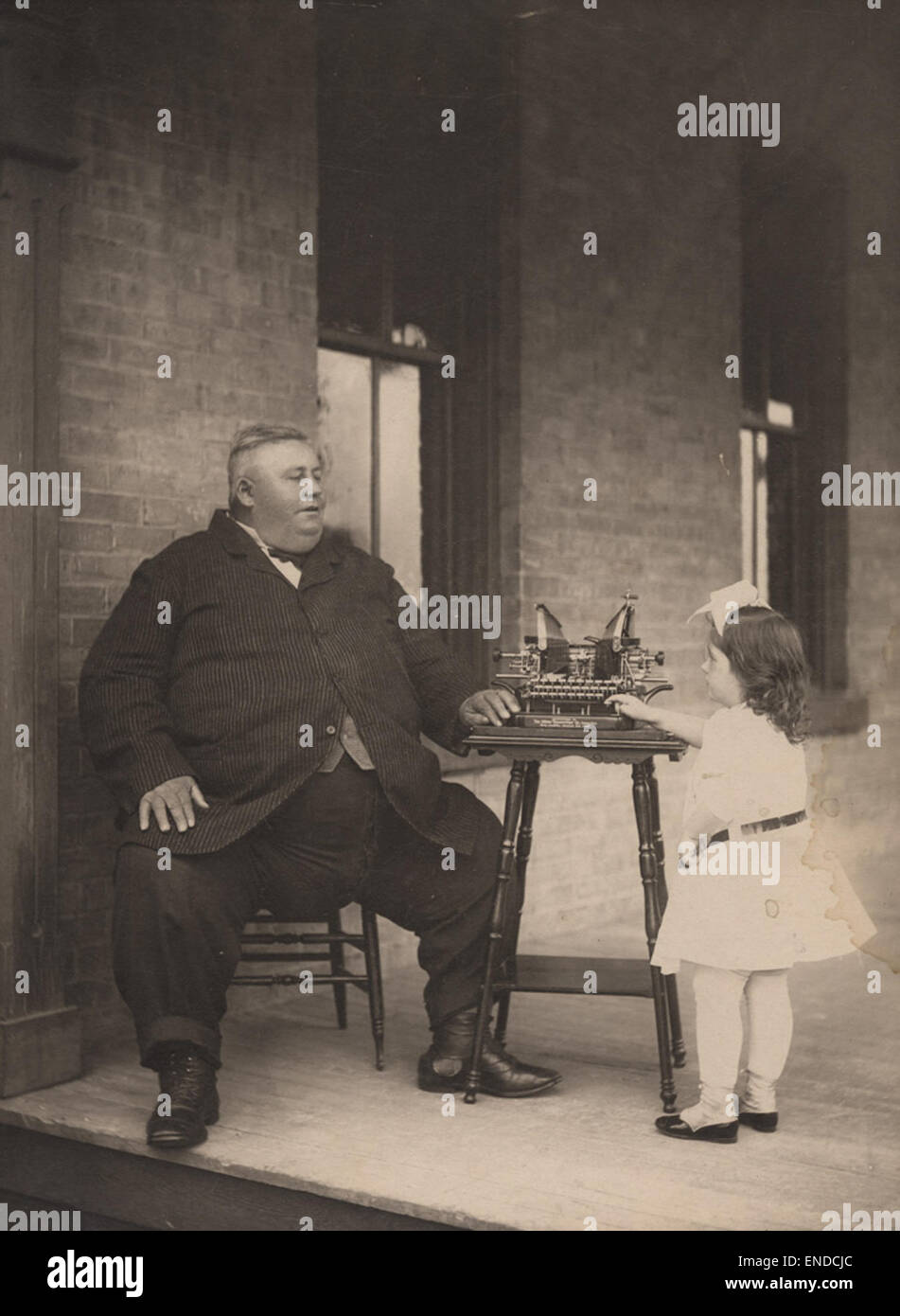 This photo captures Jonathan Miller with a young girl, in an undated ...