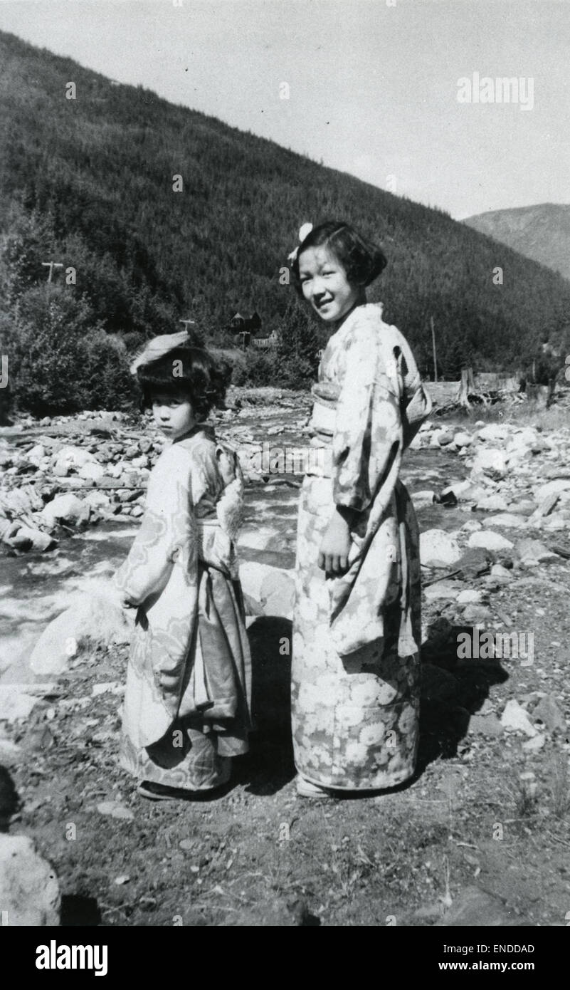 The photograph depicts two Japanese Canadian girls wearing traditional ...